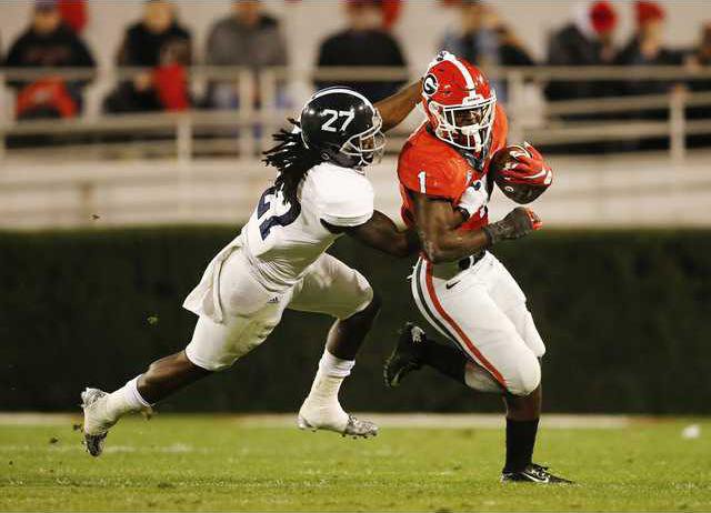 Sony Michells 25-yard touchdown run in OT gives Georgia 23-17 win over ...