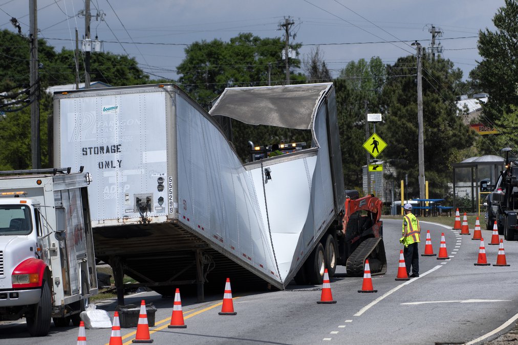 This tractor-trailer split in half, blocking Old Candler Road for hours ...