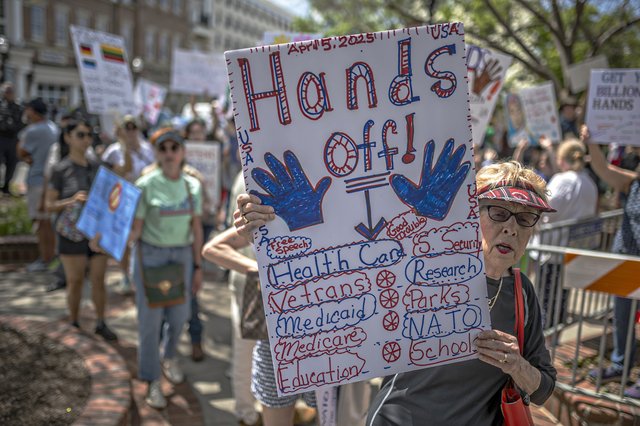 PHOTOS: Hundreds rally in Gainesville in 'Hands Off' protest against ...